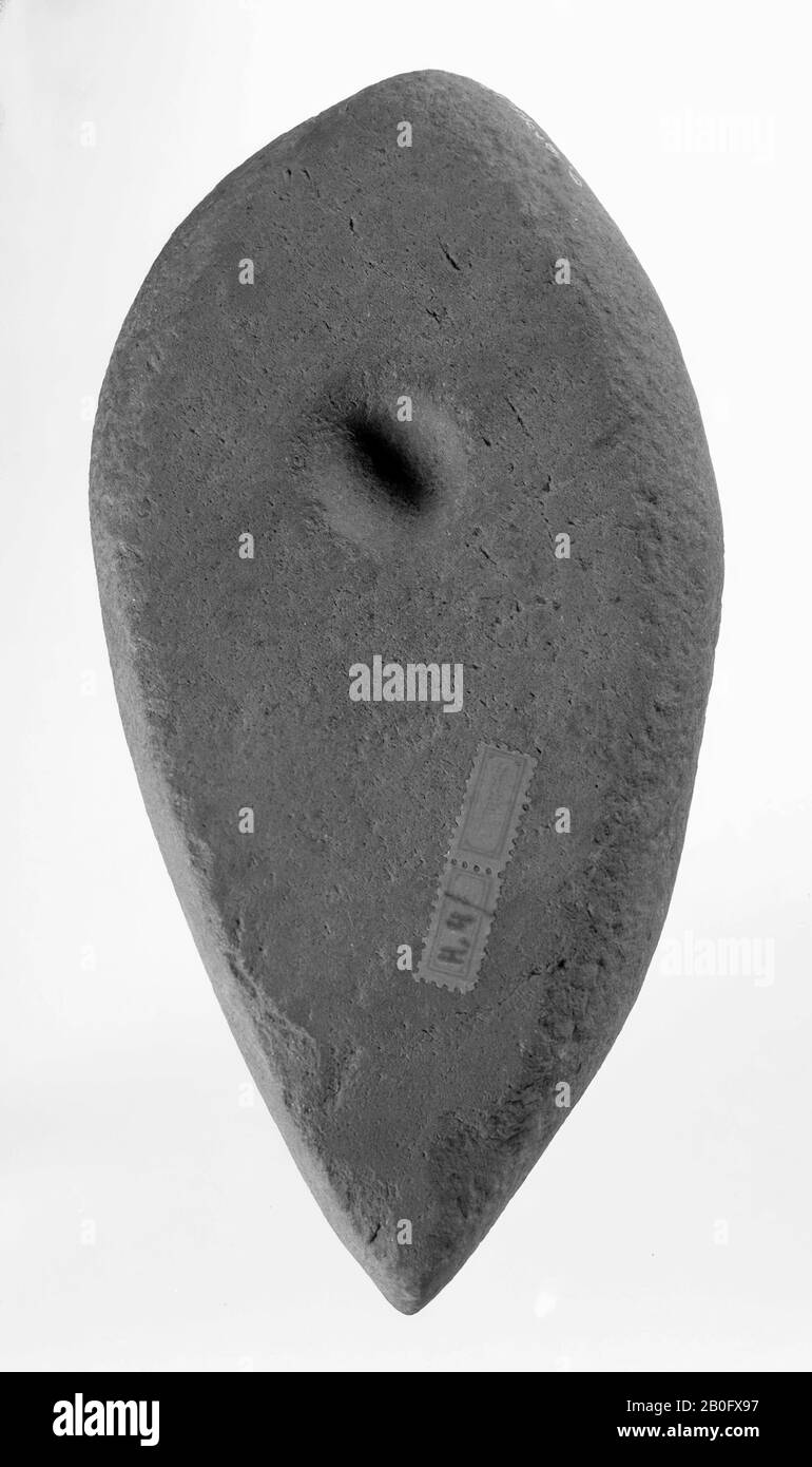 sandstone ax, roughly shaped, with a ground round hole, of which the ...