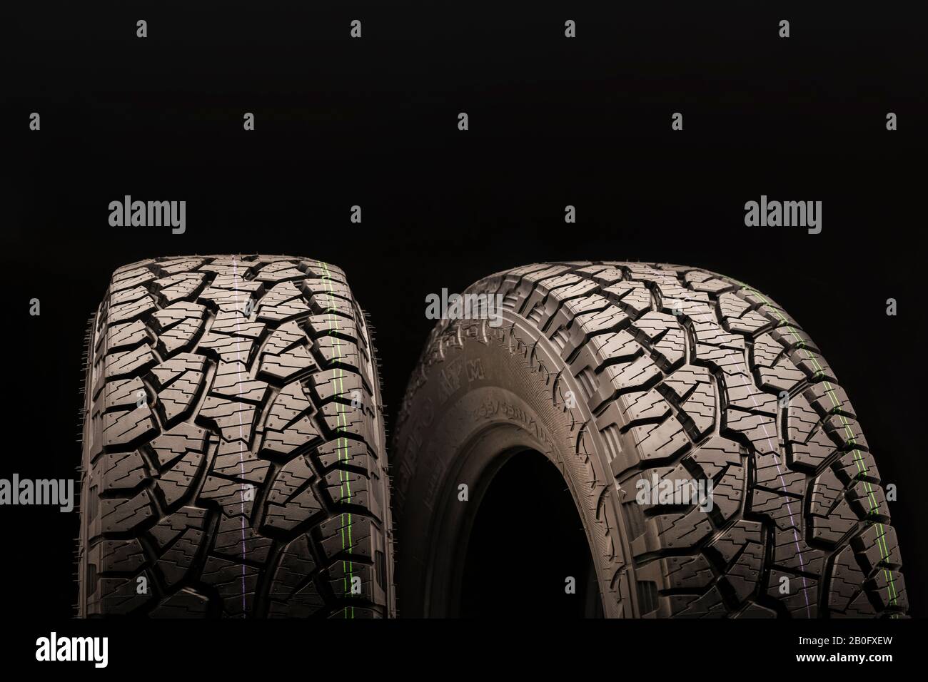 two off-road wheels with a powerful tread, mud pattern with slats, cuts ...