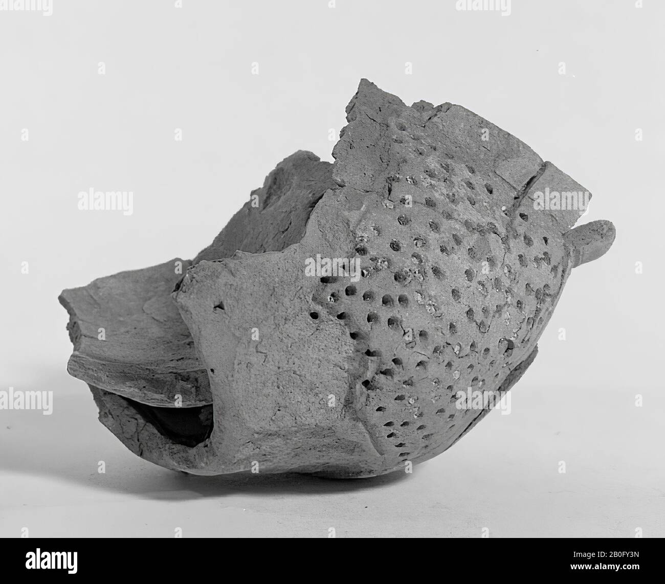 Typical bit of pottery. Deformed model. Provide pressed holes. Broken ...