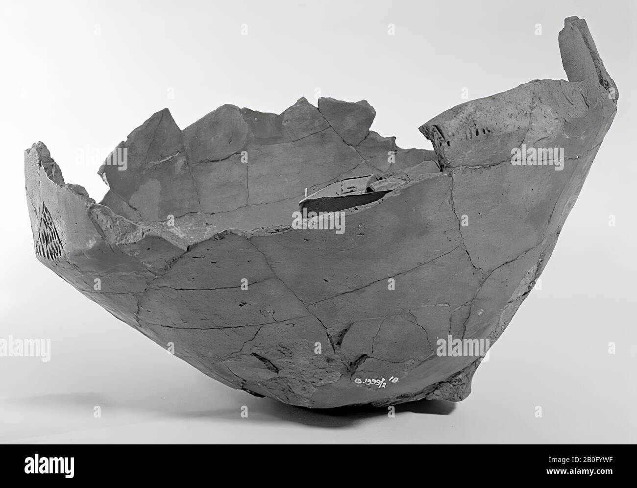 Bottom fragment of a smooth, dark, more or less double-conical urn of ...