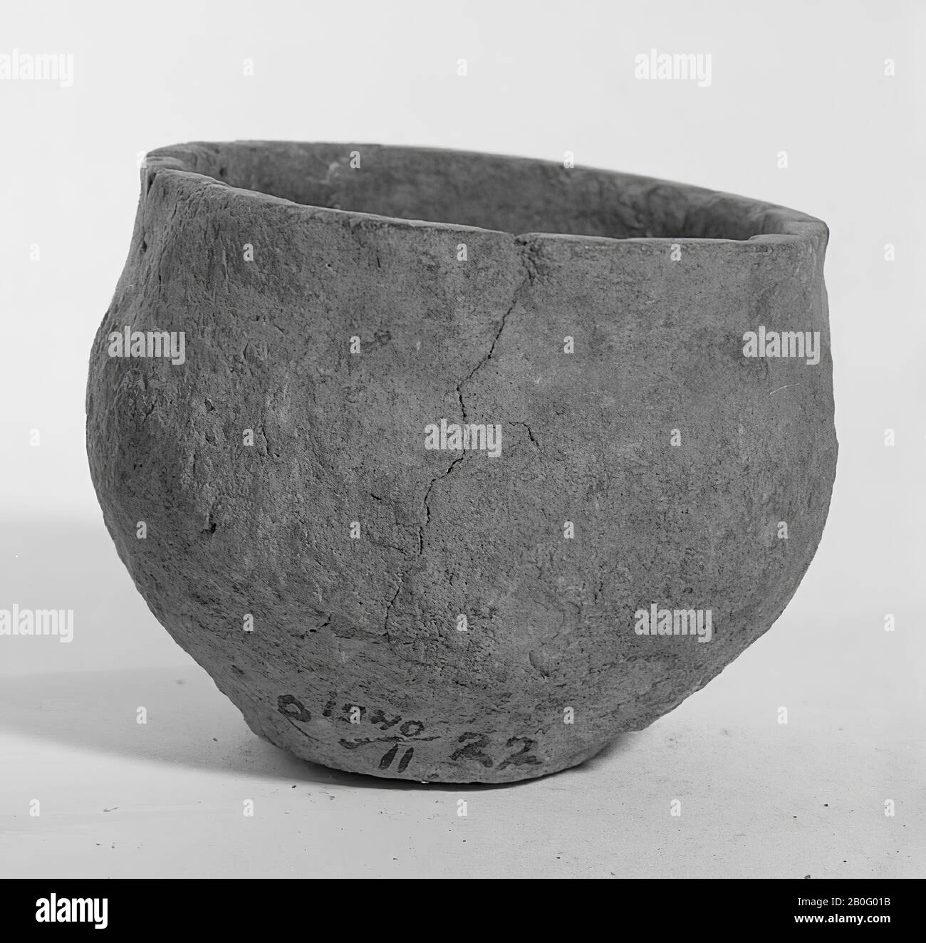 Pottery of late-urn-field type pottery. Vertical cracks from the edge ...