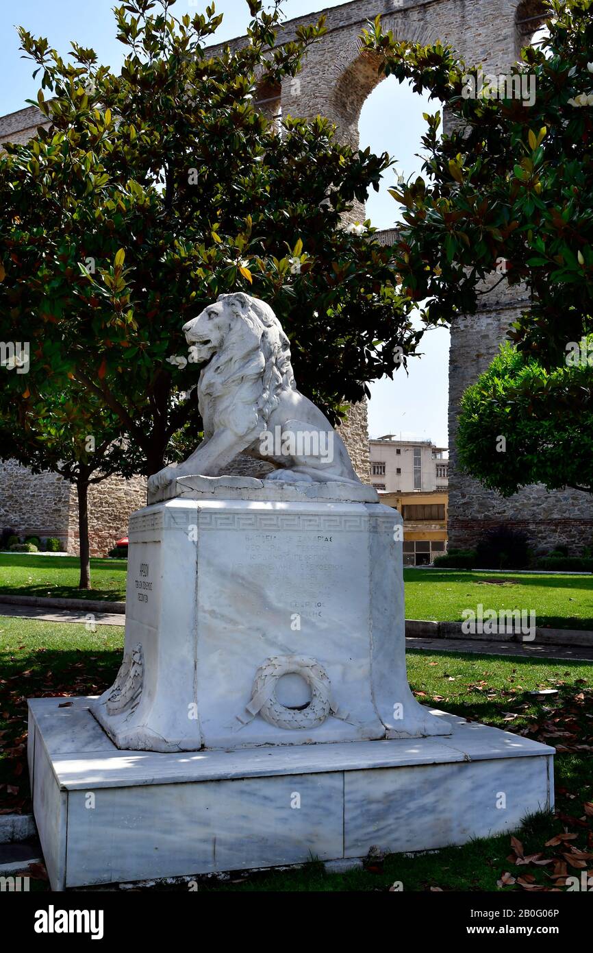 Greece, Kavala, stone lion sculpture in front of medieval aqueduct ...