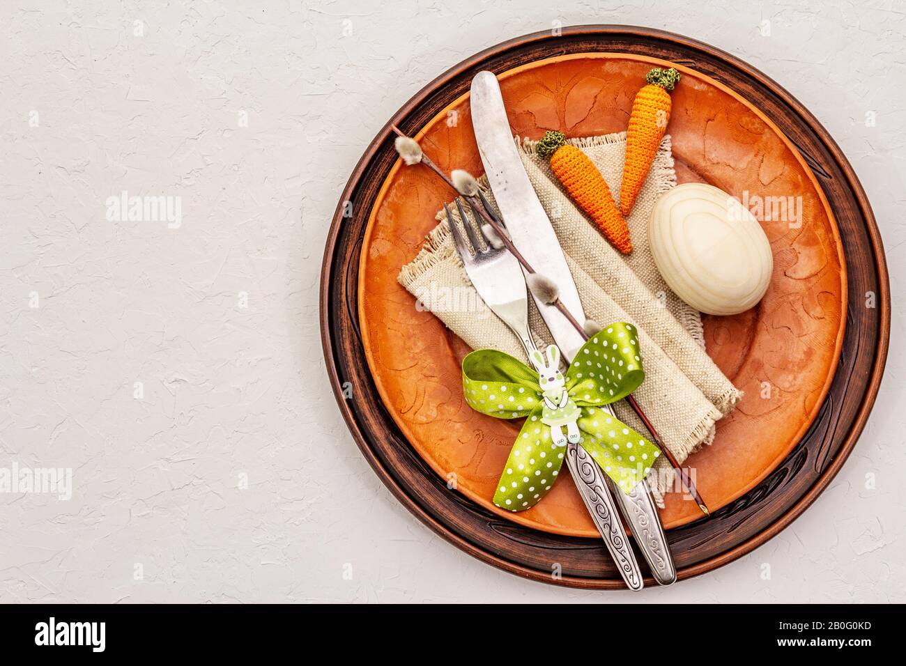 Easter table setting on textured white putty background. Spring holiday ...