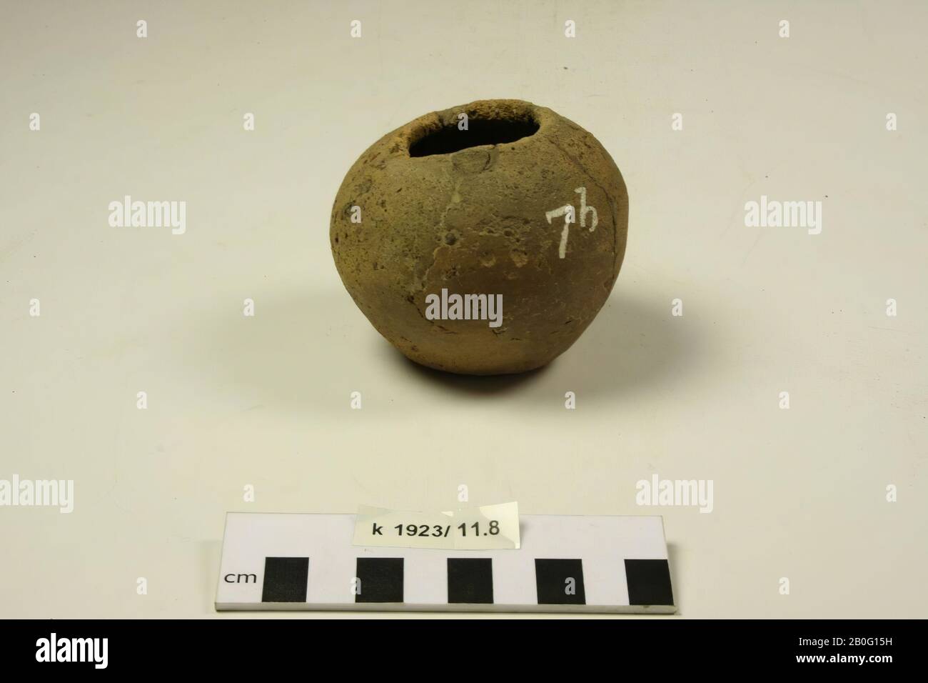 Small pot of earthenware, convex shape with narrow opening. Old ...