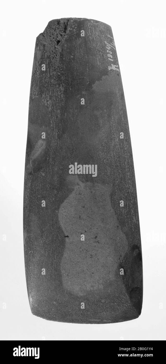 stone chisel of dark, gray-brown flint with oval cross-section and ...