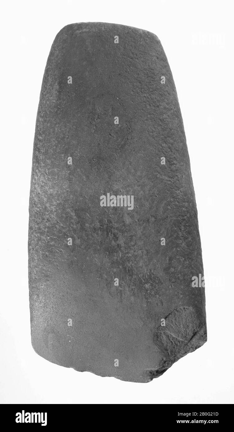 green-brown ax with rough surface and ground cut of little ...