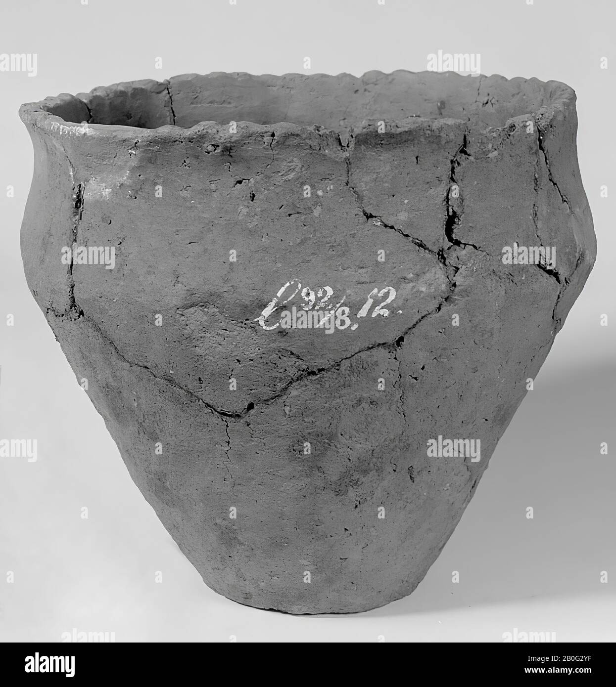 Germanic cylindrical urn of reddish-brown with stones mixed rough ...