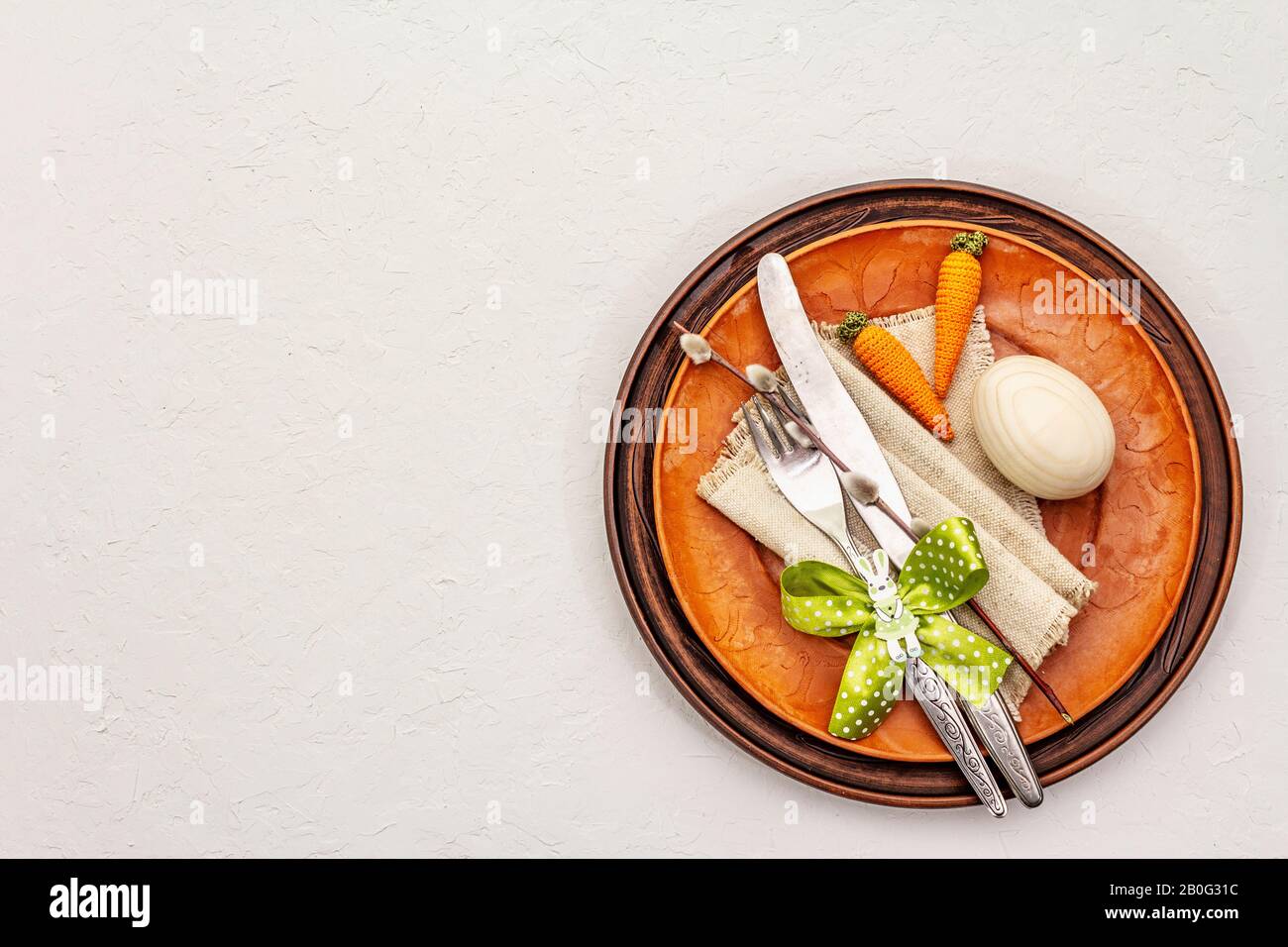 Easter table setting on textured white putty background. Spring holiday ...