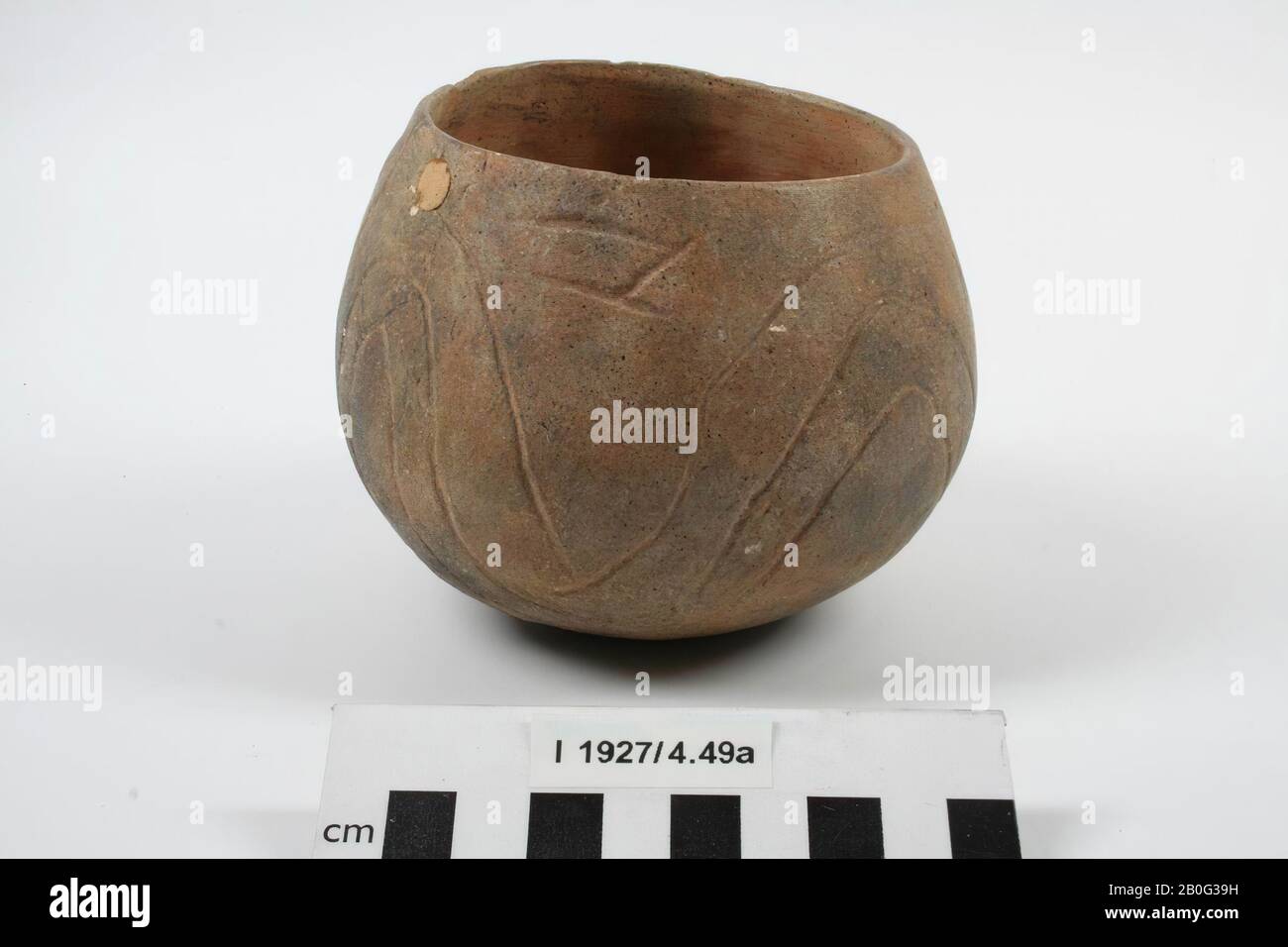 Plaster cast of a cup of decorated band ceramics. Some chips from the ...