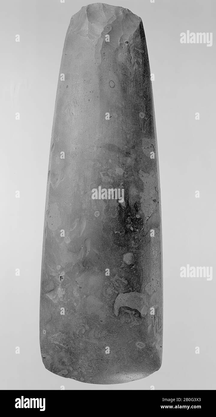 flint ax with oval cross-section, along facets and wide top. Mottled ...