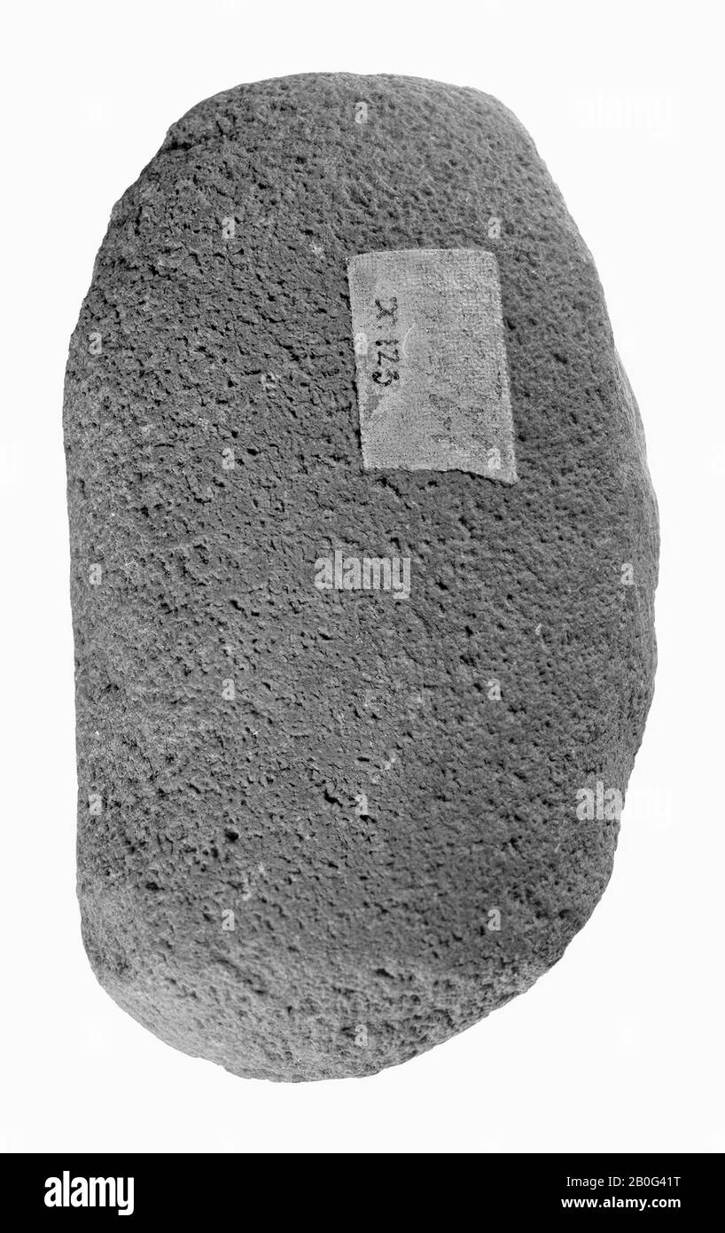 tapping stone of porous, light gray quartzite, cylindrical, stone ...