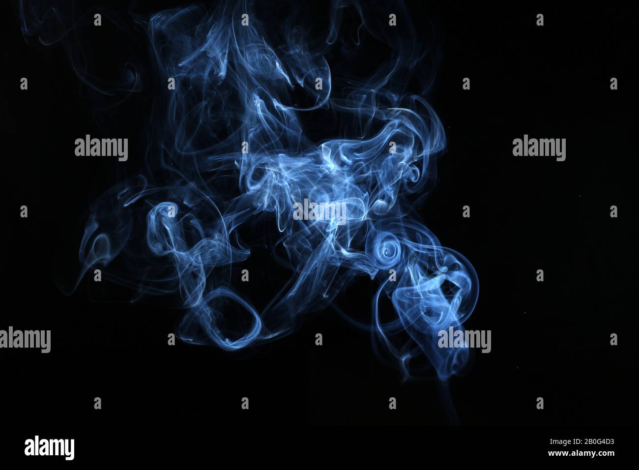 The abstract picture of the smoke. made by usage of the flash against ...