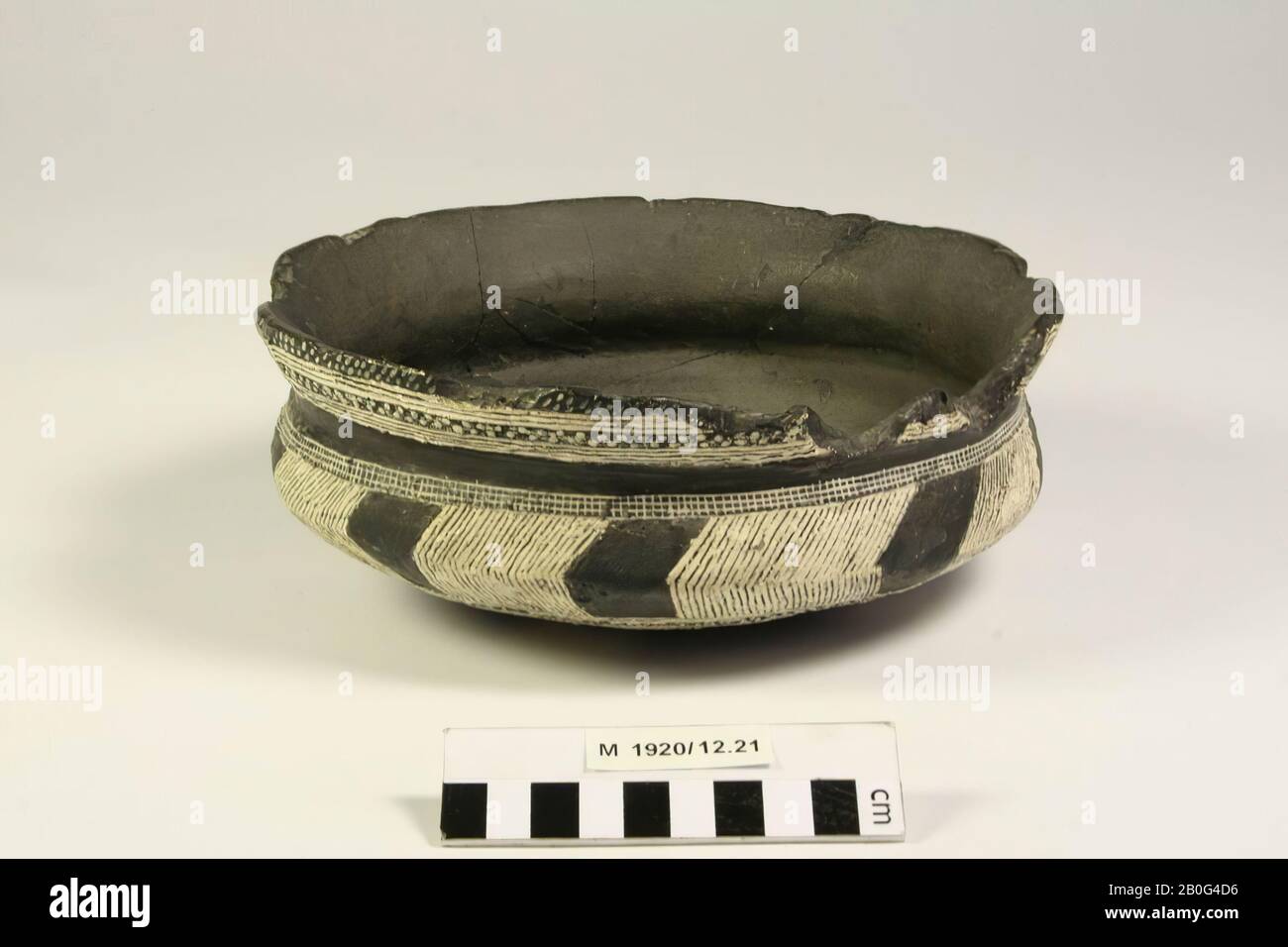 Casting of a scale with incised and sludge decoration. Old bondings and ...