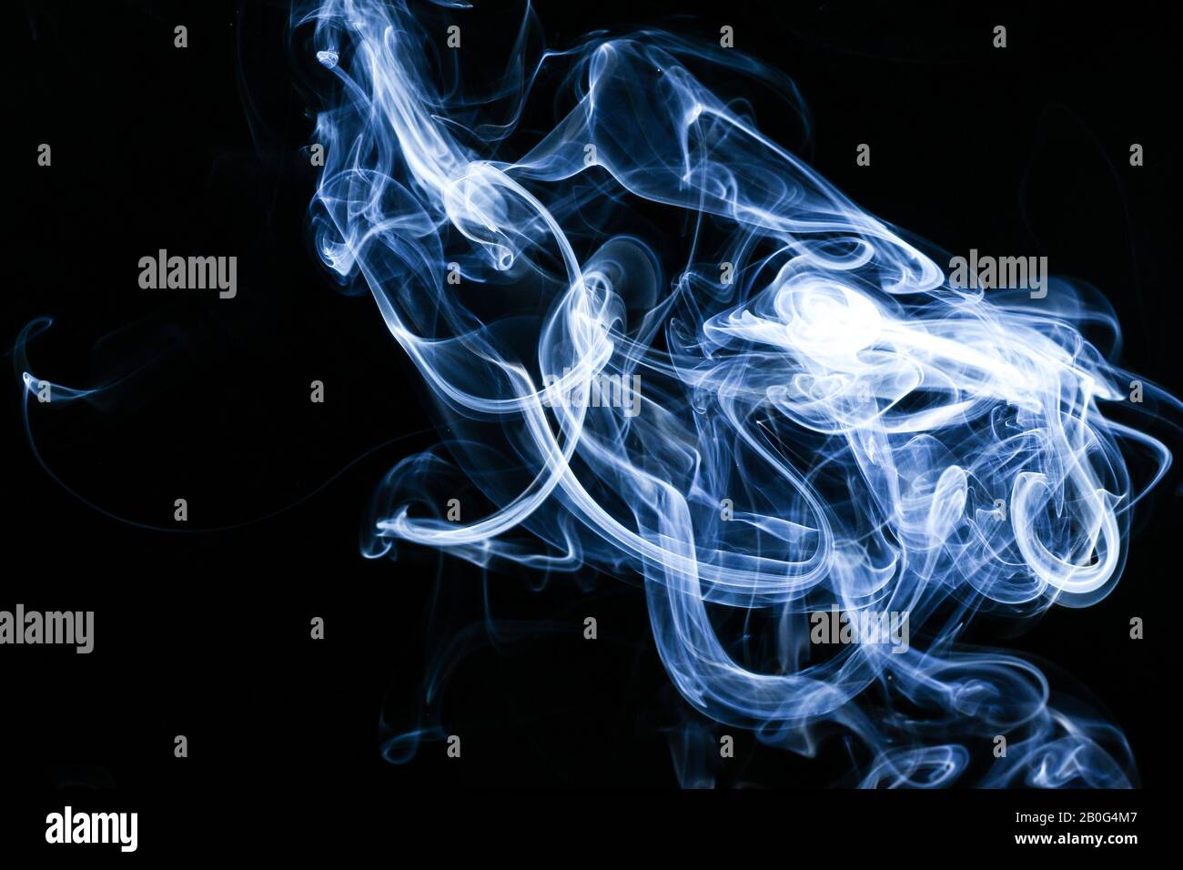 The abstract picture of the smoke. made by usage of the flash against ...