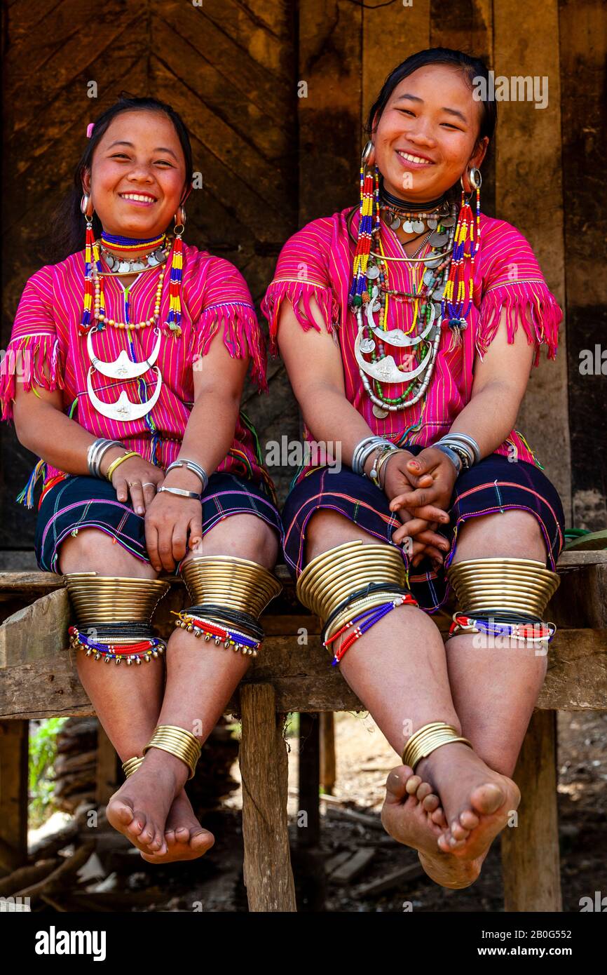 Two Young Women From The Kayaw Ethnic Group Sitting Down Outside Their ...