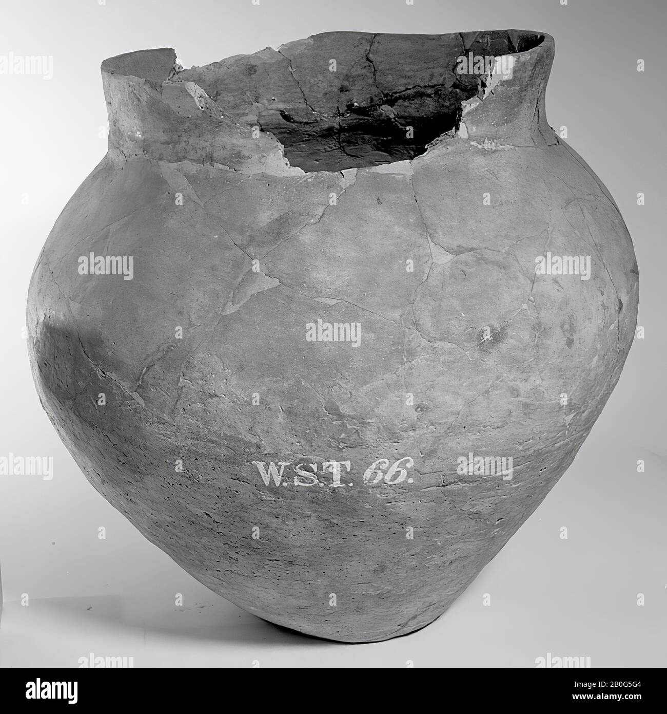 Gray urn of baked earth. Damaged on the edge, cracked, old bonding, 9 ...