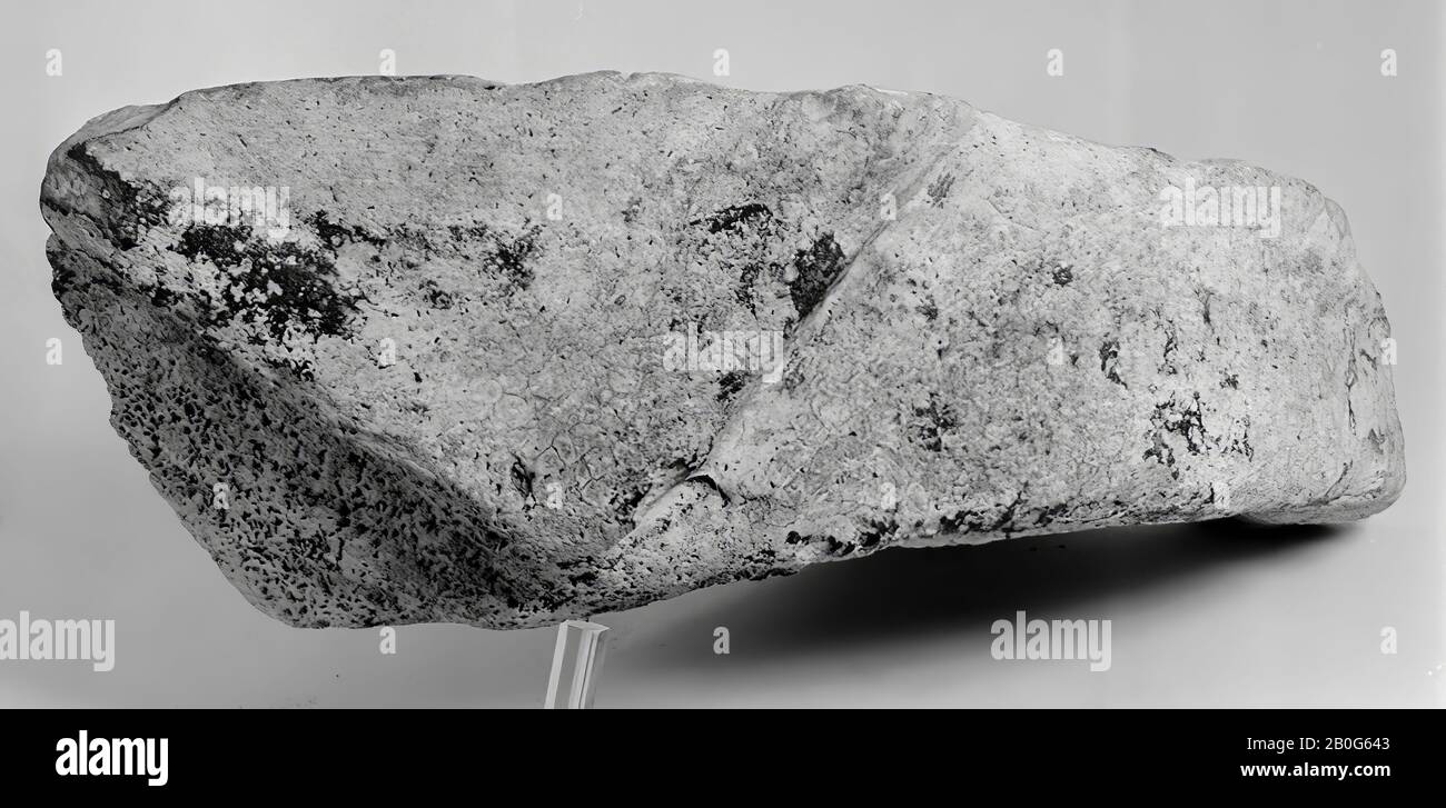 Upper part of a small altar with niche. Limestone. Nothing remains of a ...