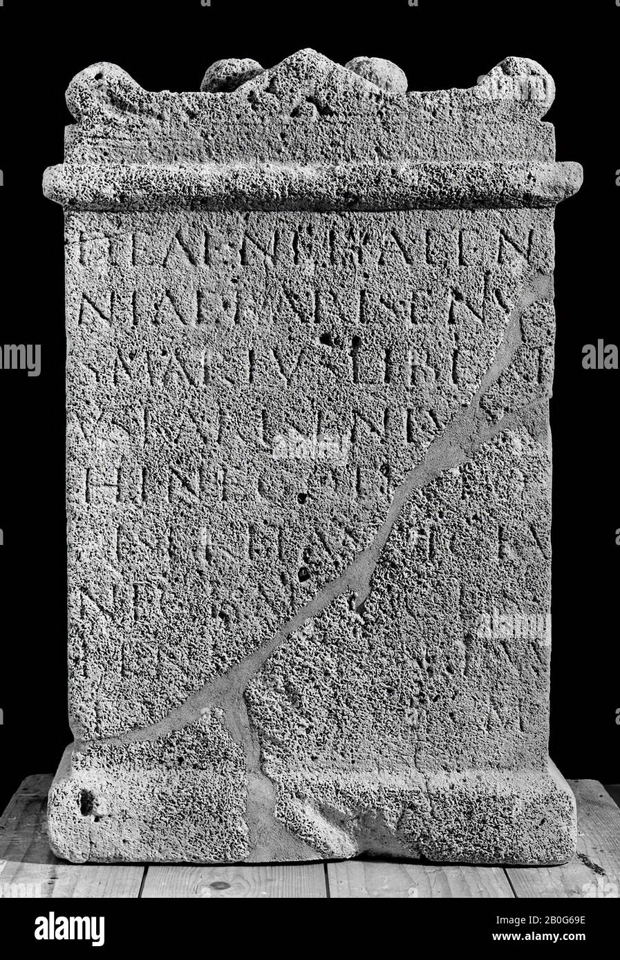 Fragment from the left part of an altar. Limestone. On the left is a ...