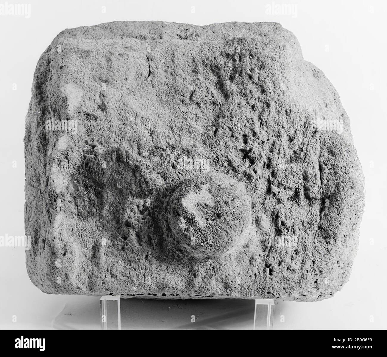 Right upper corner of an altar. Limestone. On the mensa is a round ...