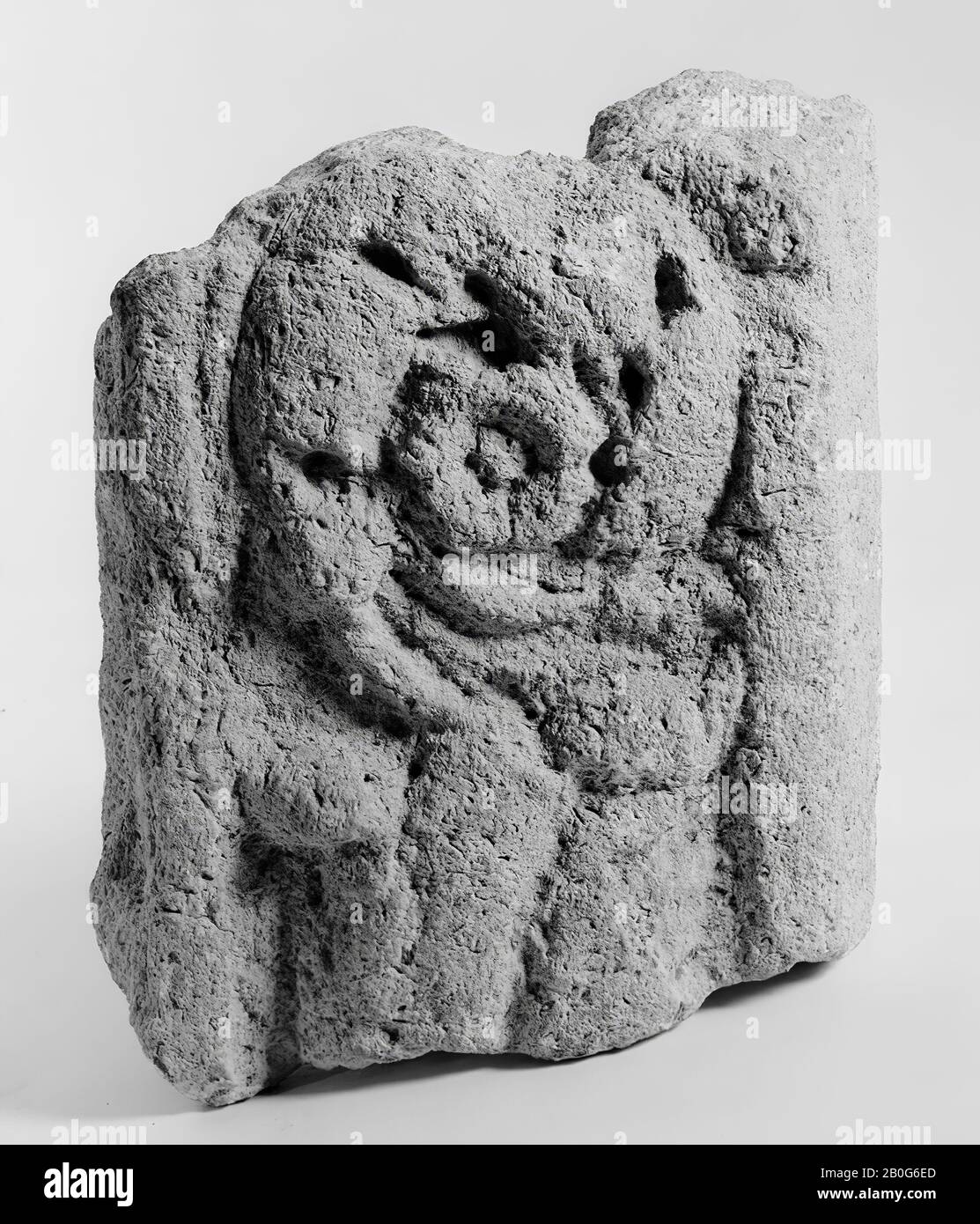 Fragment from the right part of an altar. Limestone. The side has a ...