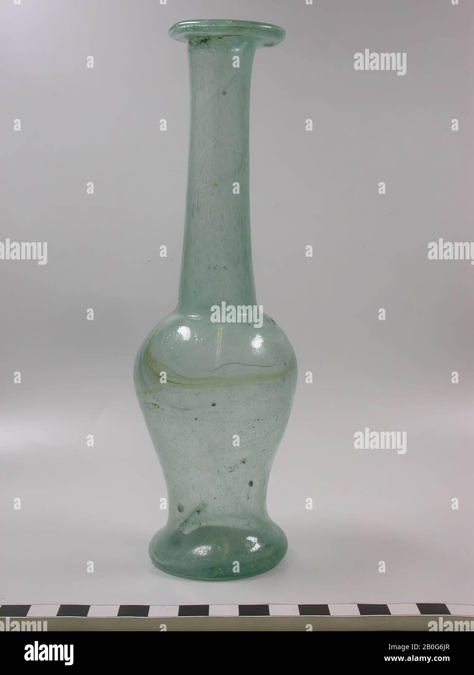 Bottle of light green, transparent glass with lots of air bubbles. Very ...