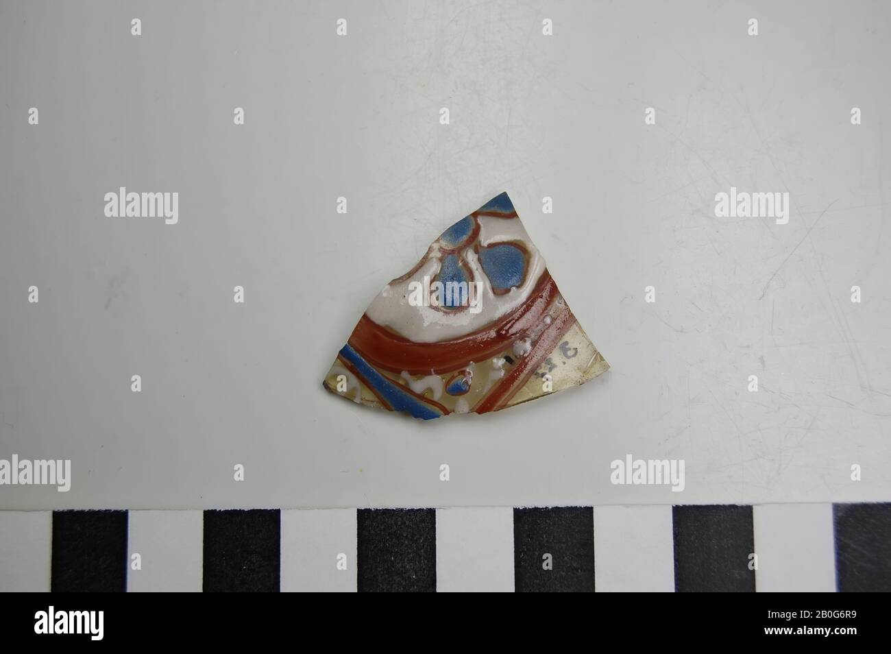 Glass shard of transparent glass, decorated with blue and red., Shard ...
