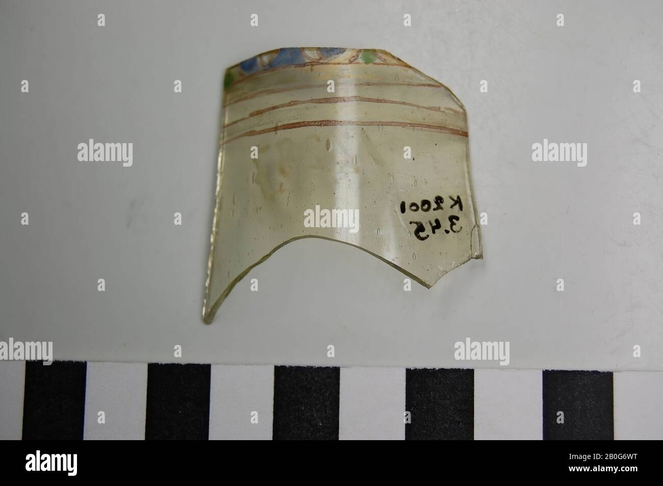 Glass shard with the colors red, blue and gold. In the glass air ...