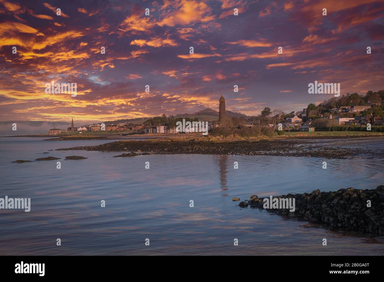 Largs foreshore looking past the Pencil Monument to the town itself as ...