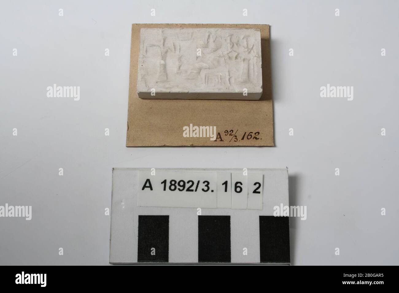 print, cylinder seal, plaster, 2.5 x 4.4 x 0.6 cm, cardboard: 4.9 x 5.1 ...