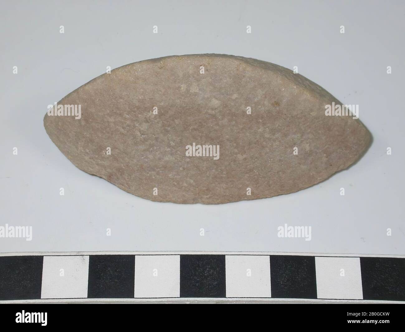 Flour with three flat sides. It is beige-gray in color., Tool ...
