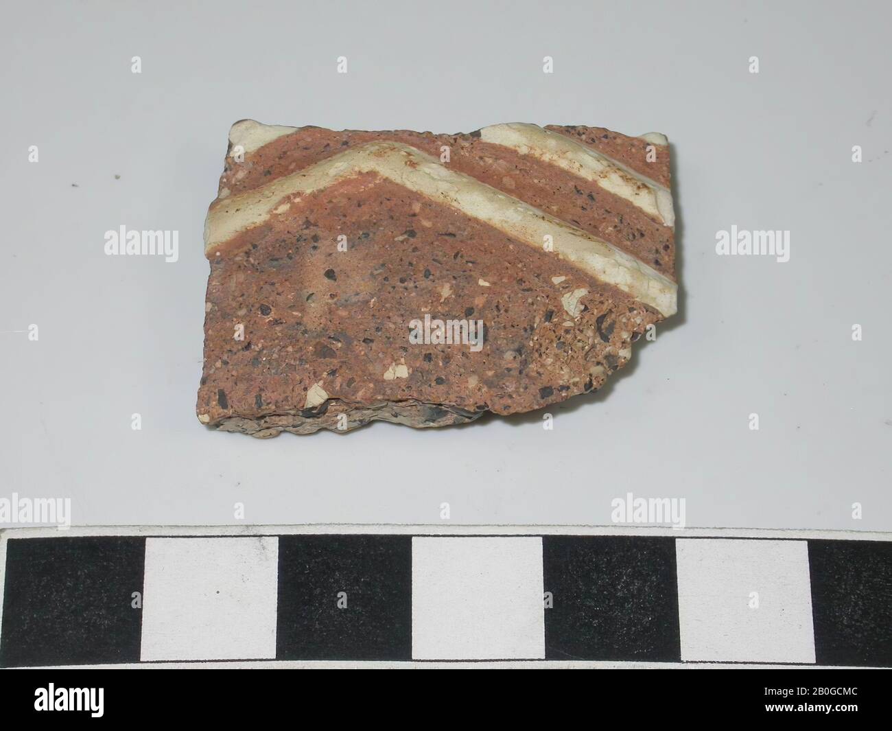 Small shard of very coarse clay (many black, white, gray inclusions ...