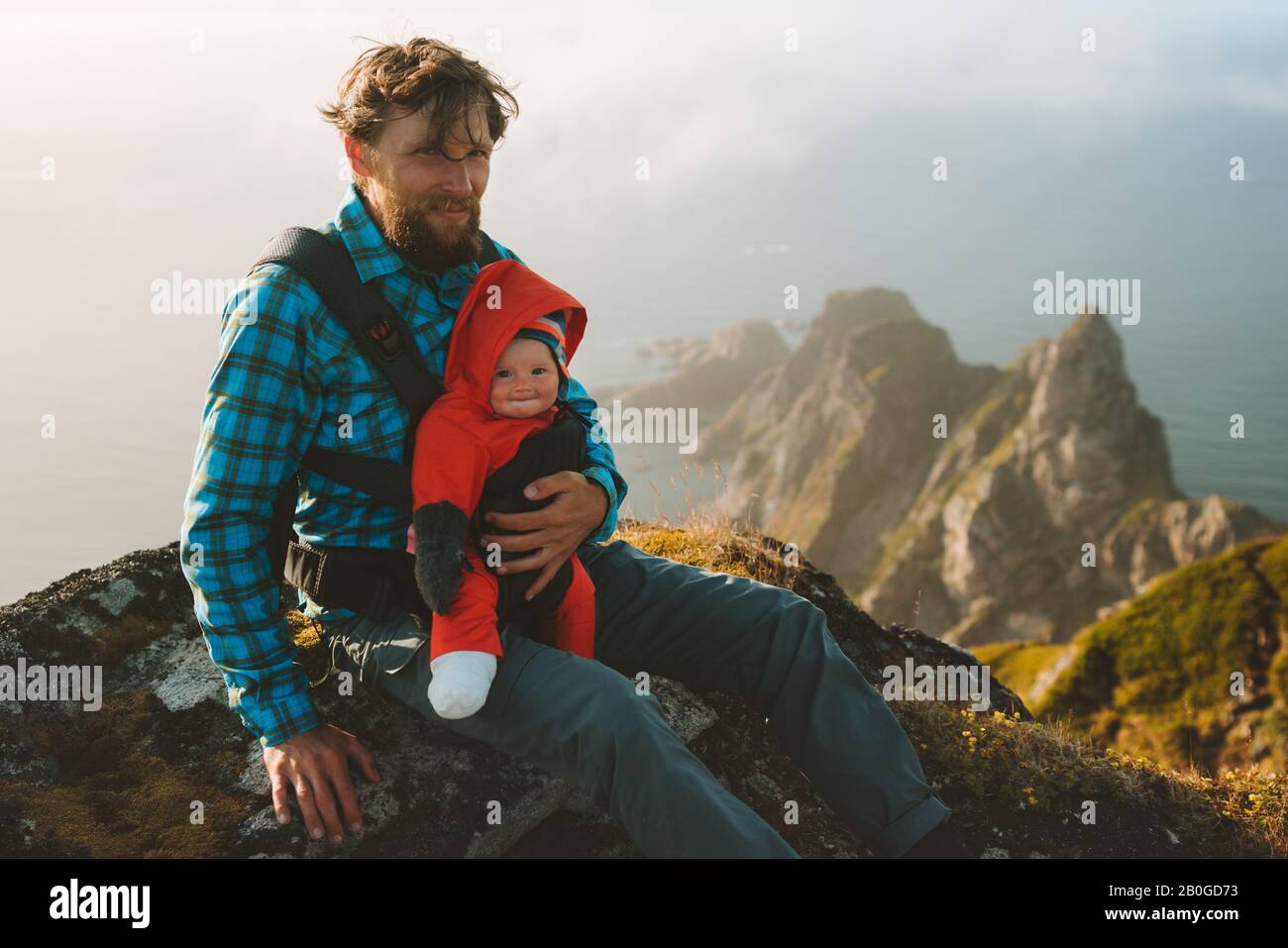 Father hiking with baby family traveling in Norway healthy lifestyle ...