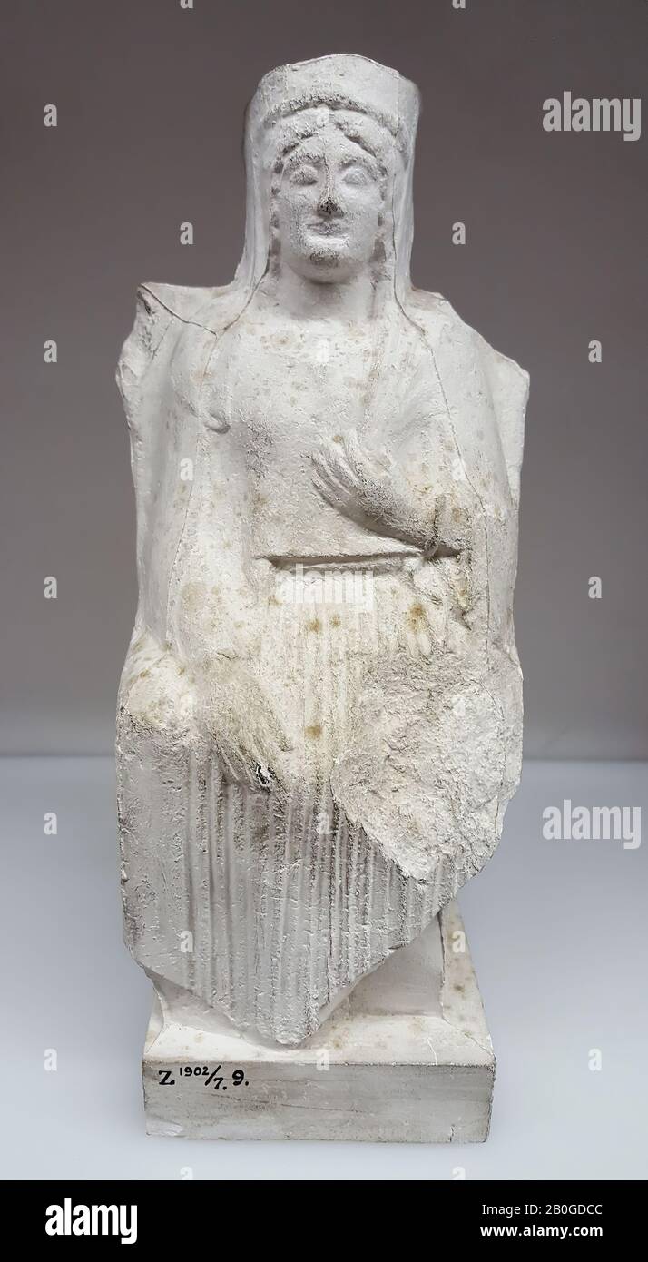 Demeter, shown with a wrist, sitting on a chair, the left hand on the ...
