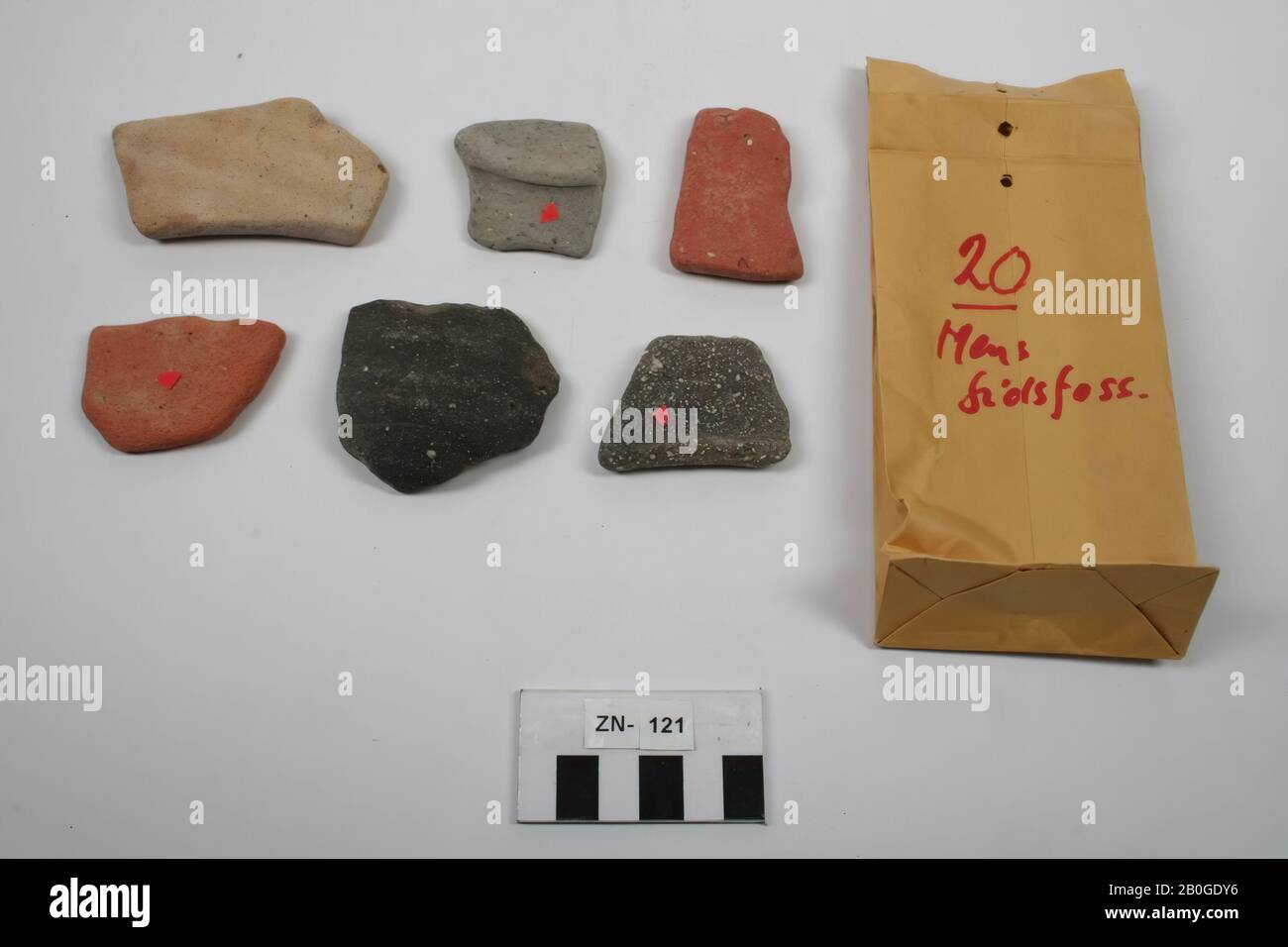 6 Shards of different types of pottery. The shards have a red sticker ...