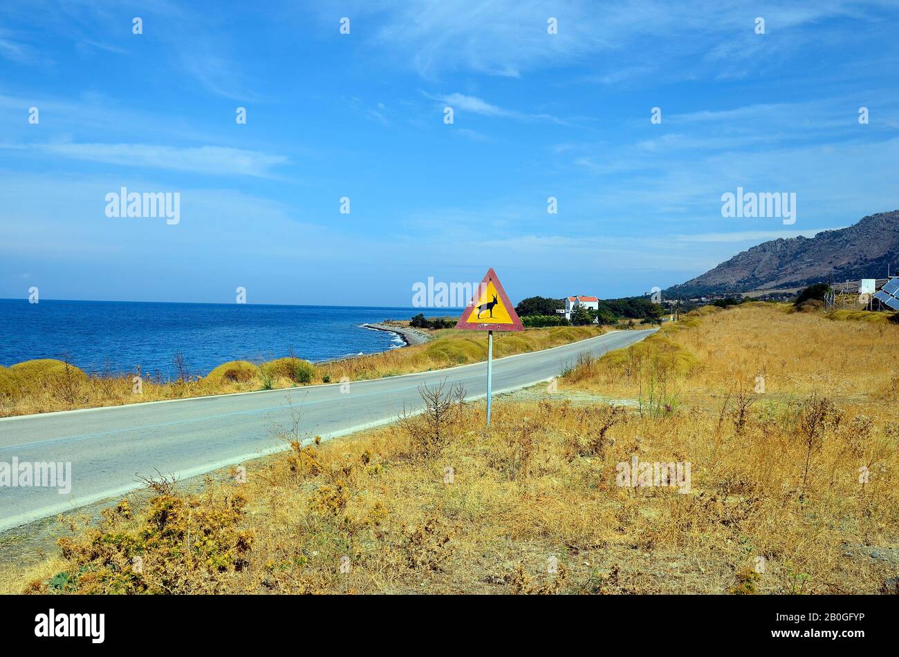 Greece, Samothrace, coastal road with warning sign for goats Stock ...
