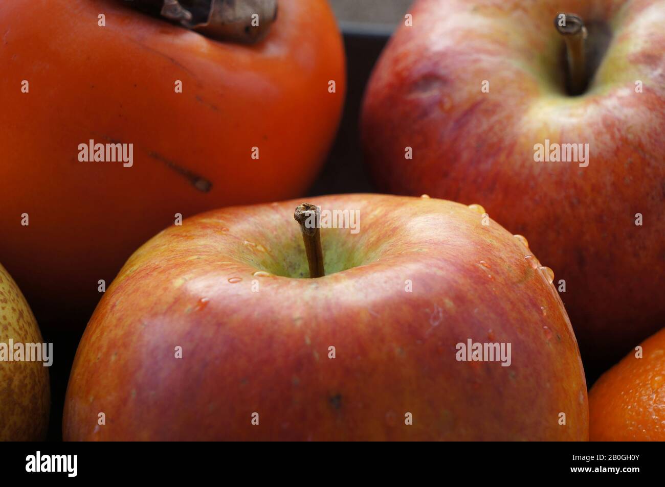close up of red apples and fruit with water drops on their skins Stock ...