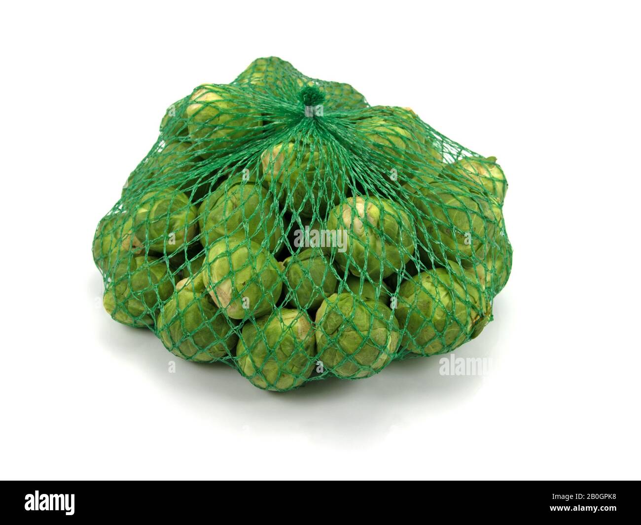 Brussels sprouts in the net against white background Stock Photo - Alamy