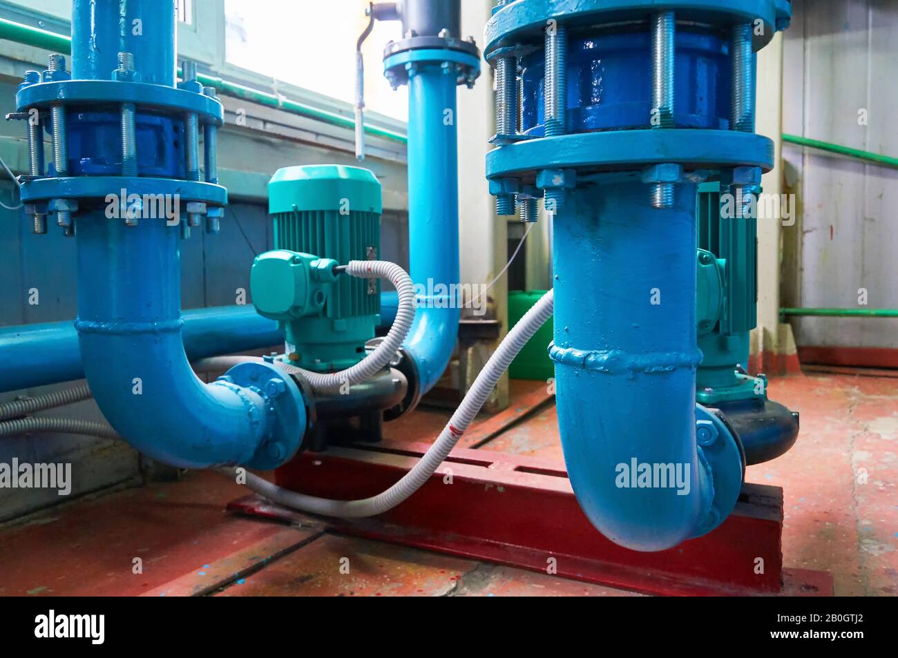 Vertical slot motors on pumps water conduit colored in blue Stock Photo ...