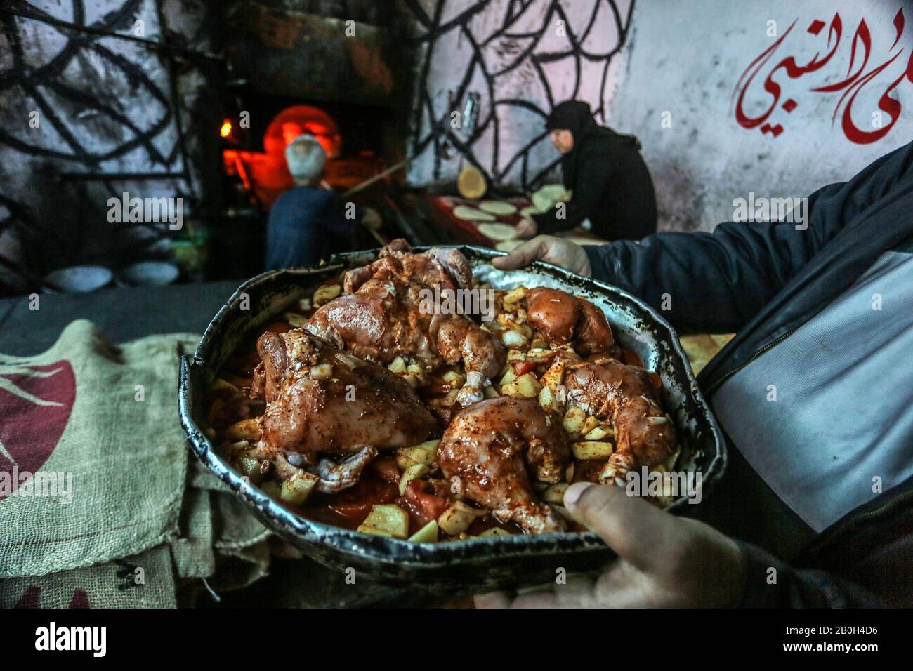 Palestinian man works in the only traditional bakery that stays working ...