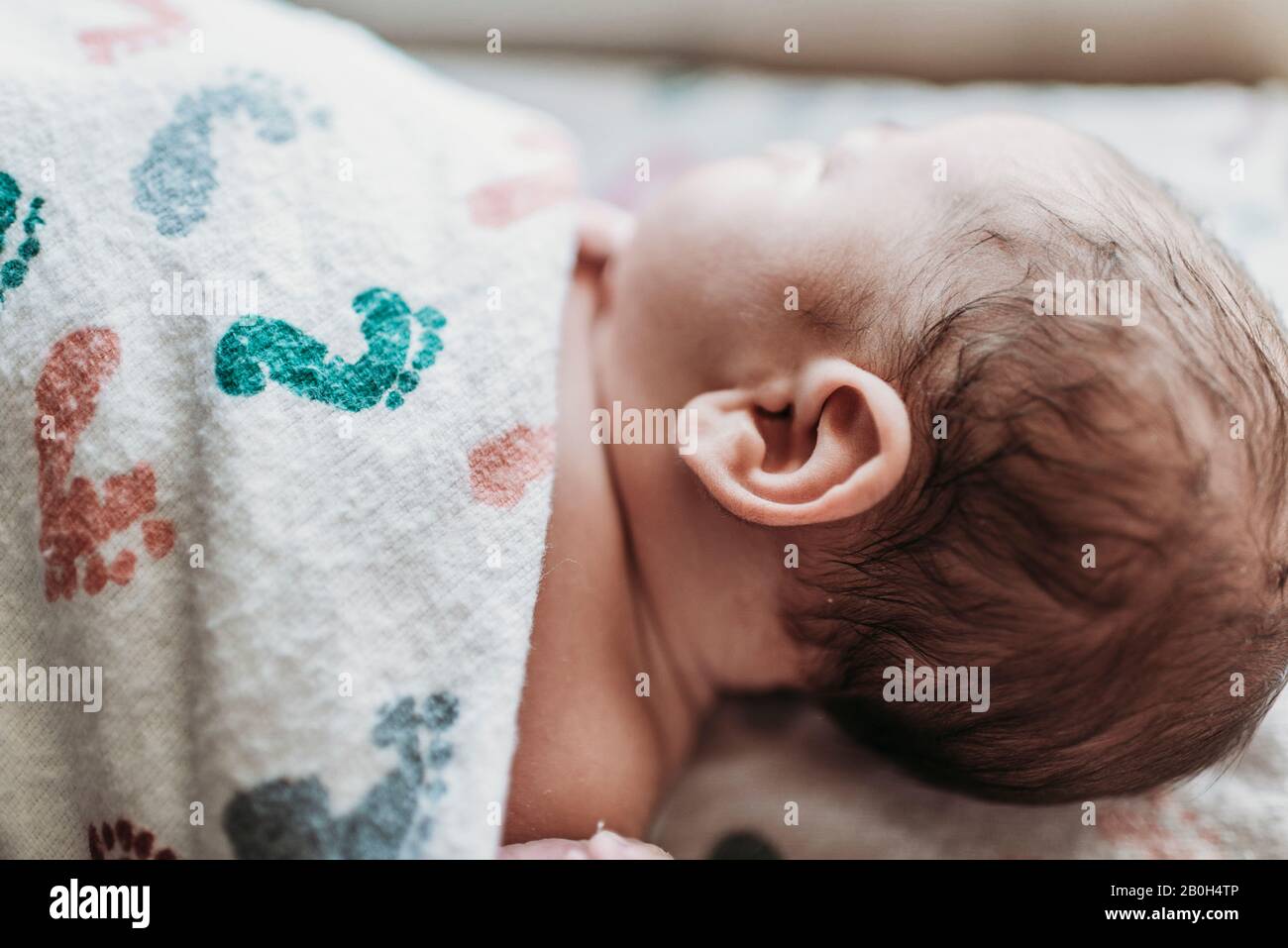 Close up detail of newborn boy ear in hospital Stock Photo - Alamy