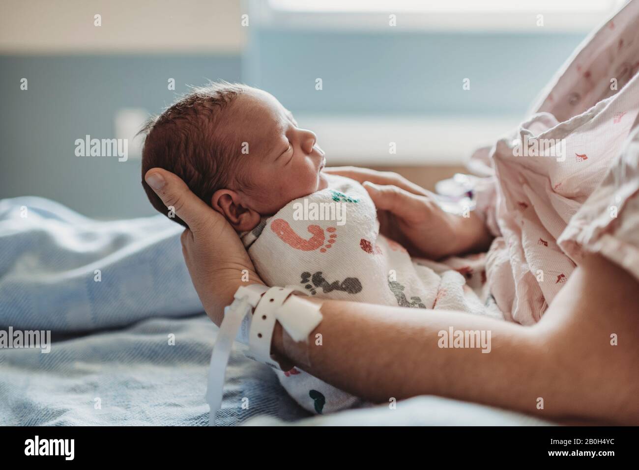 Side view of newborn boy profile with hat in hospital Stock Photo - Alamy