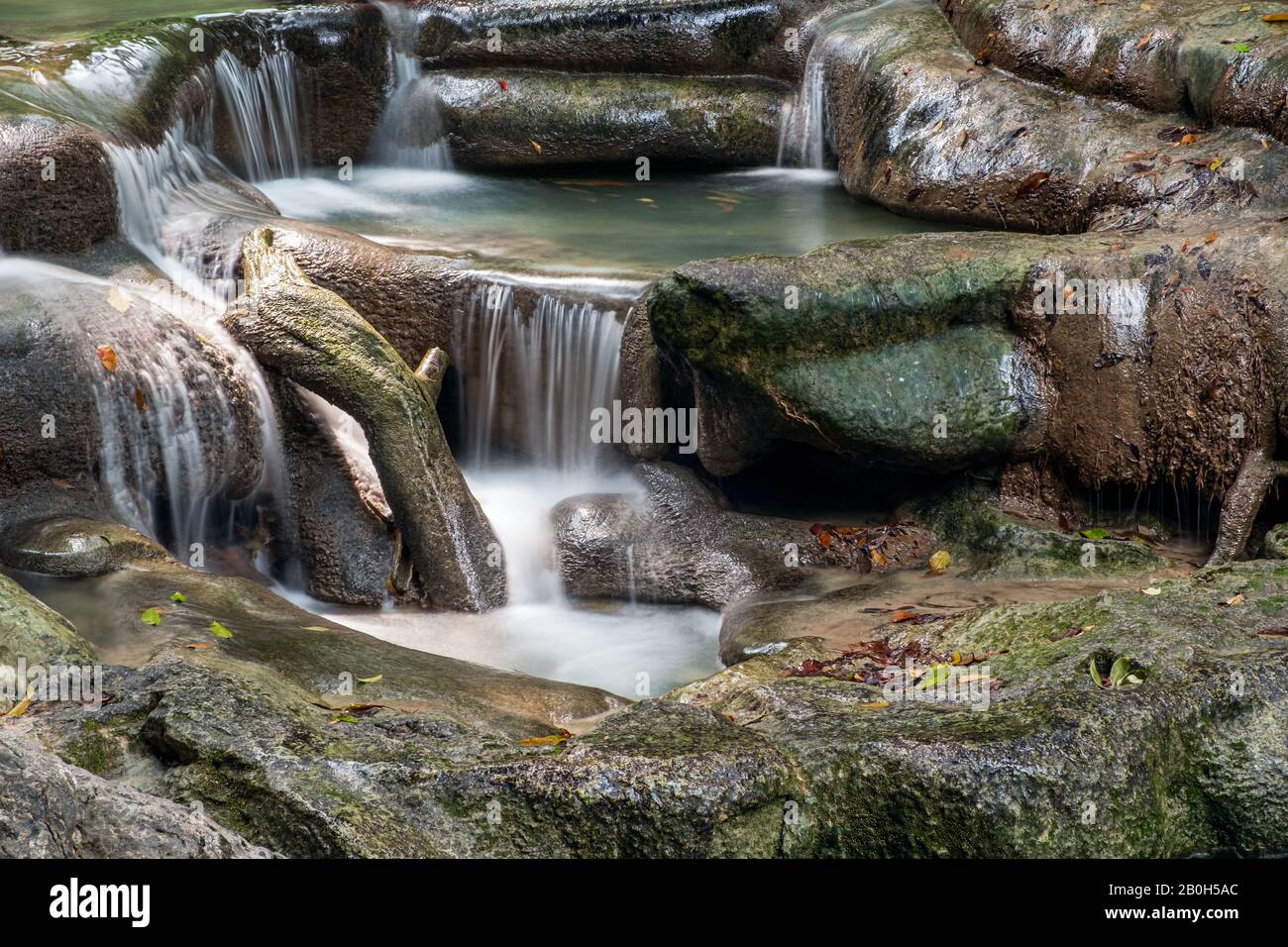 Waterfall in national park in jungle, long exposure, in Kanchanaburi ...