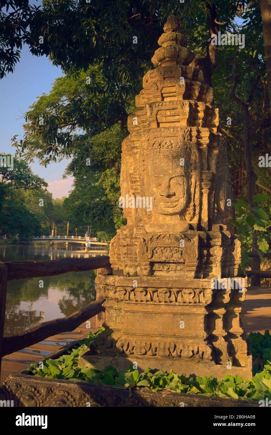 Ancient Khmer stone face monument by the river near Siem Reap, Cambodia ...