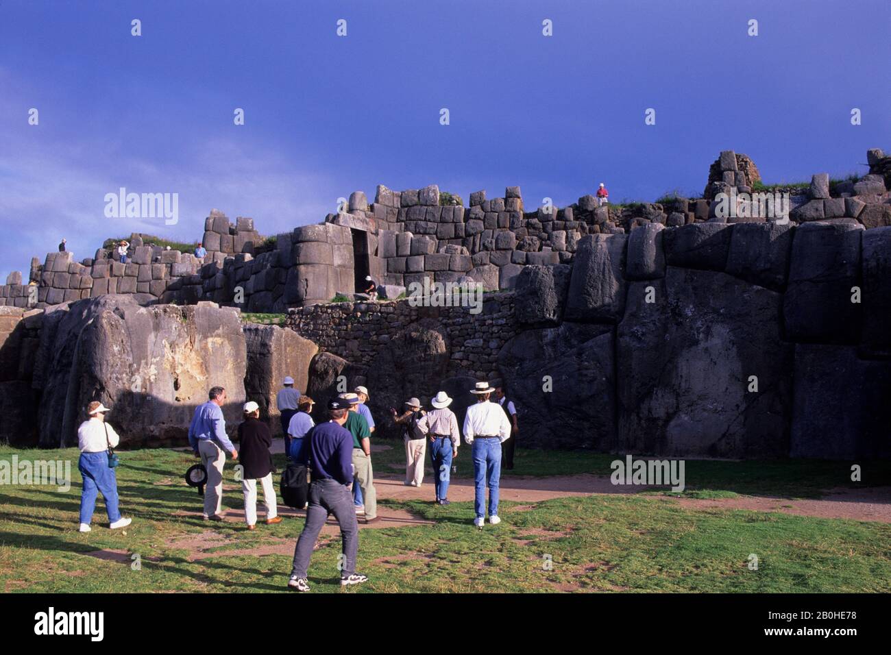 PERU, NEAR CUZCO, INCA FORTRESS OF SACSAYHUAMAN, TOURISTS Stock Photo ...