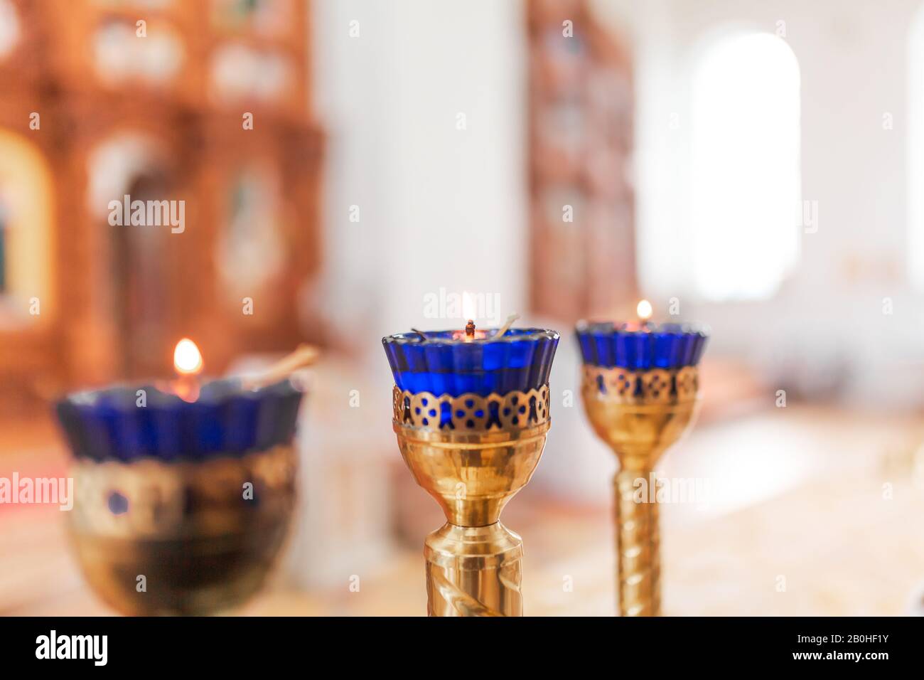 Orthodox Church Lamp with lit Candle and Red Glass on the icon ...