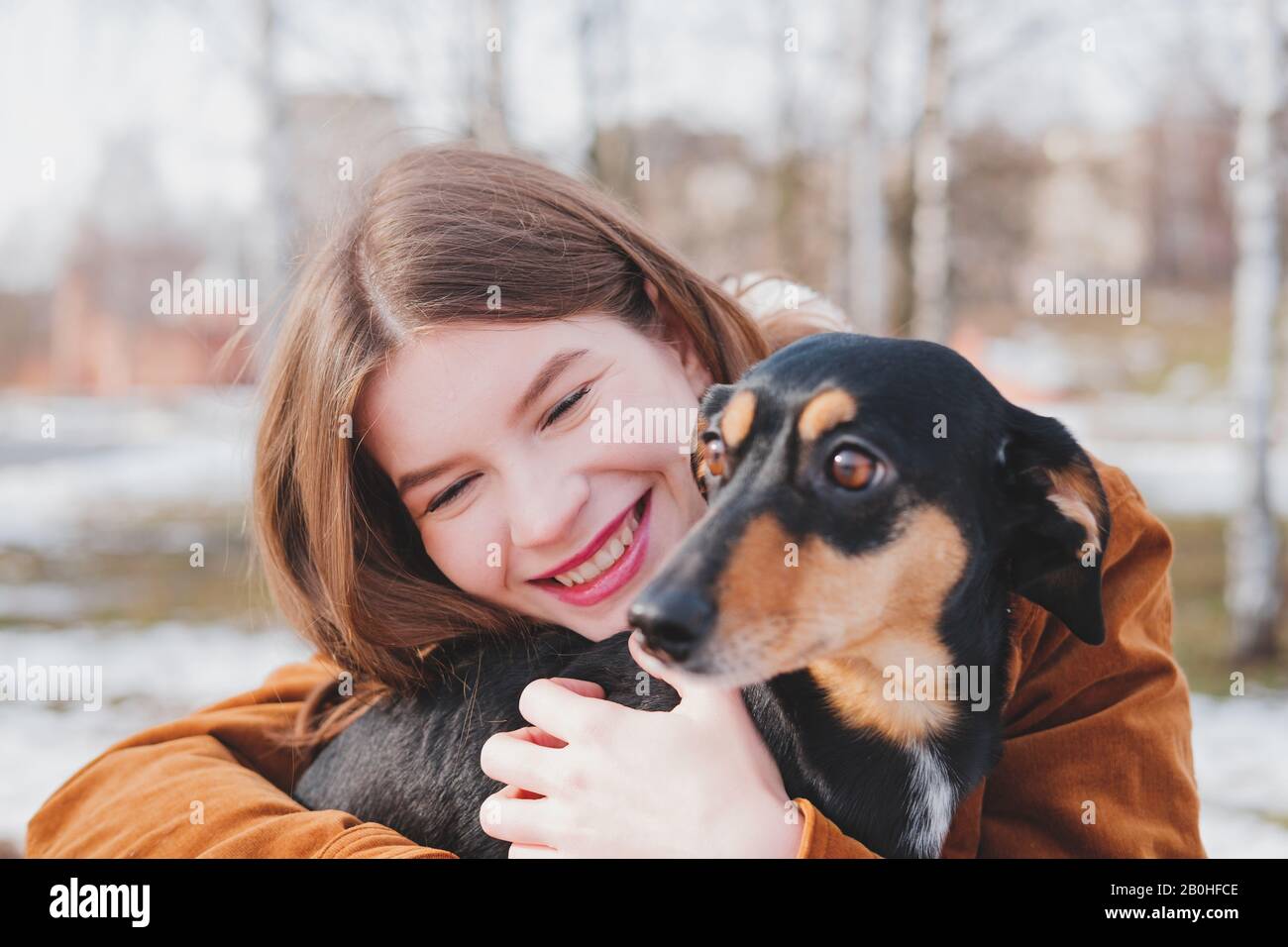 Human being happy with a dog. Loving pets concept: happy young woman ...