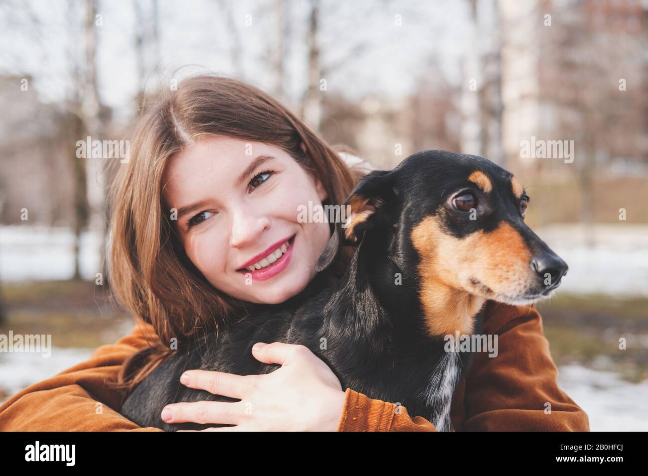 Human being happy with a dog. Loving pets concept: happy young woman ...