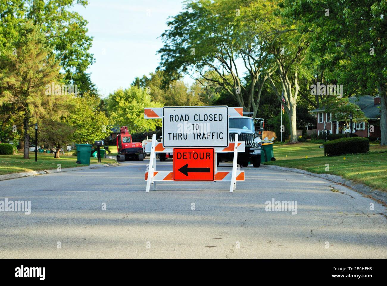 road closed to thru traffic detour construction sign in a residential ...