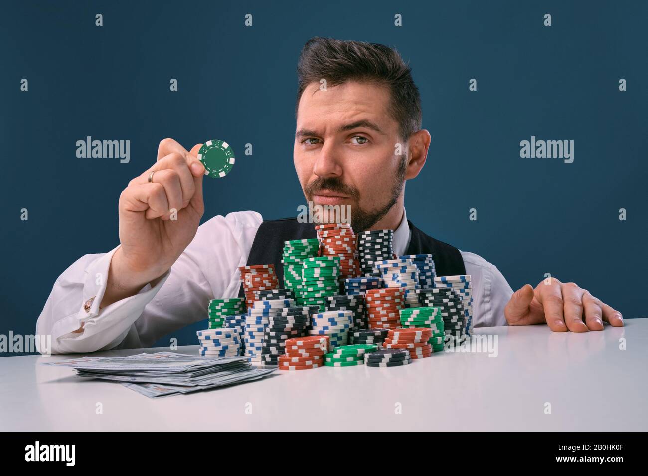 People sitting poker table playing hi-res stock photography and images ...