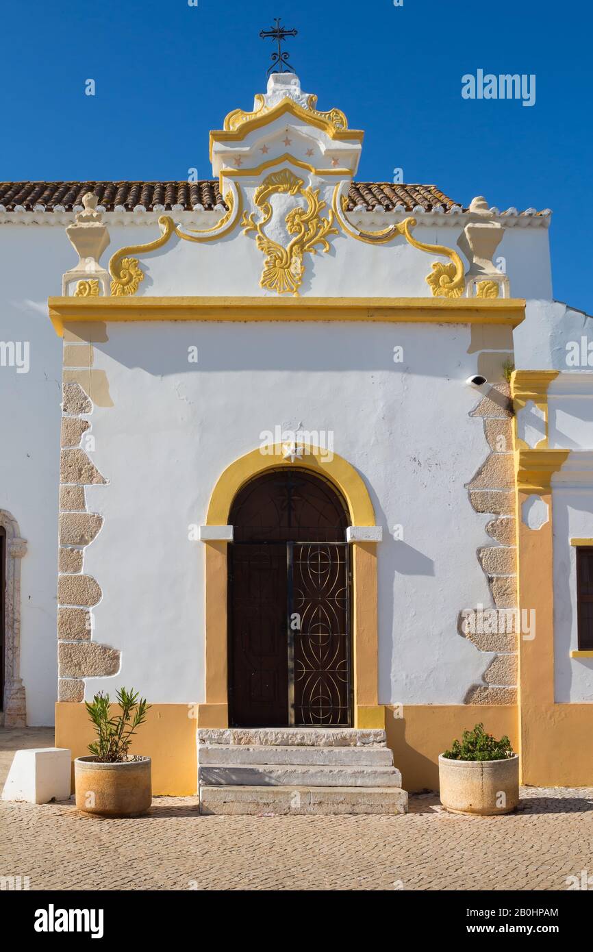 Entrance to Igreja Matriz de Alvor - church in a portuguese city. White ...